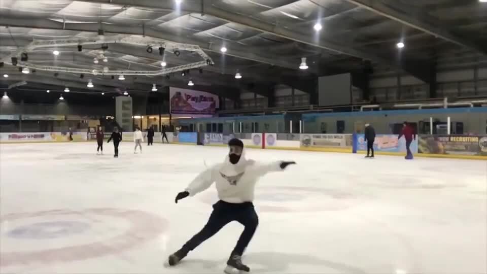 Guy in Mask Does Ice Skating Freestyle