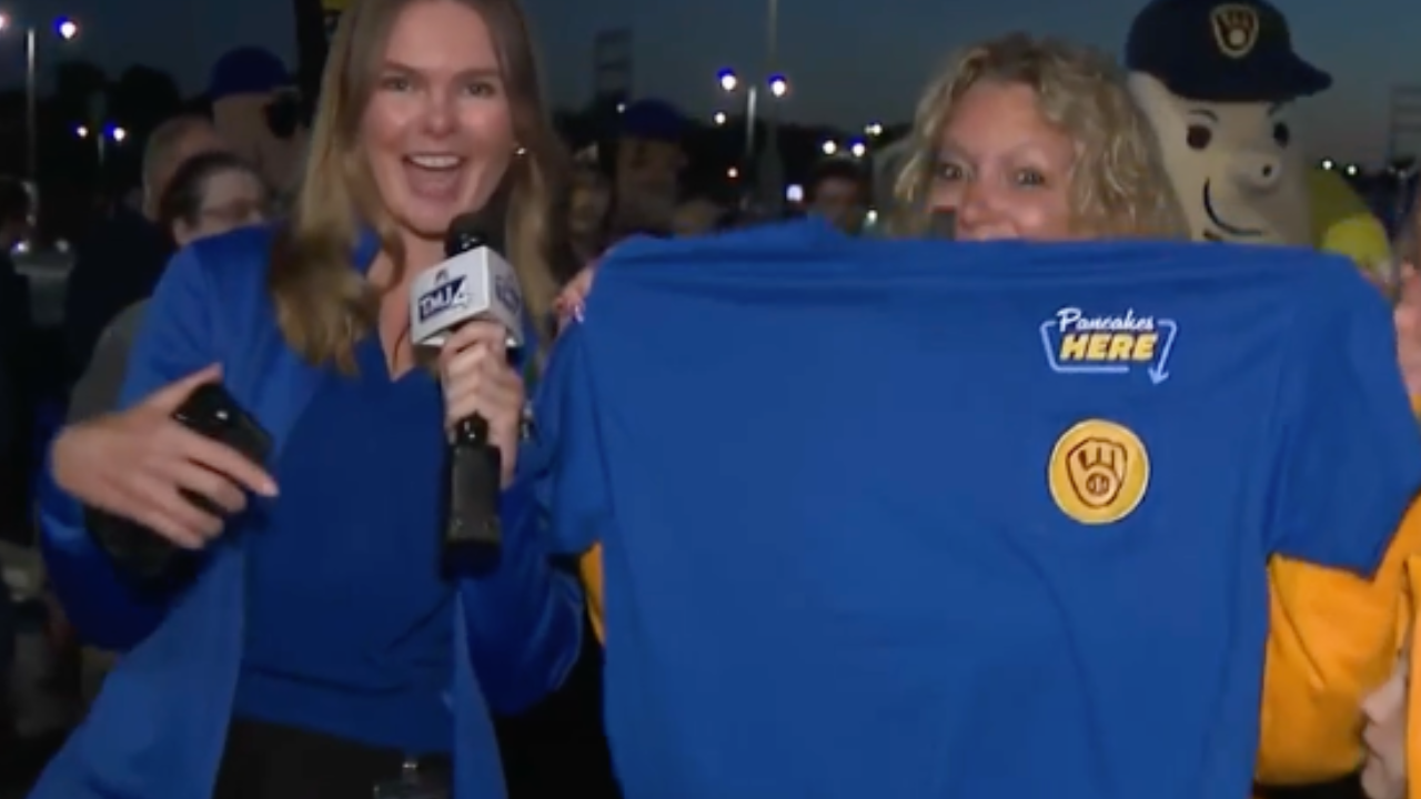 Brewers fans show off limited-edition T-shirts at postseason pocket pancake breakfast