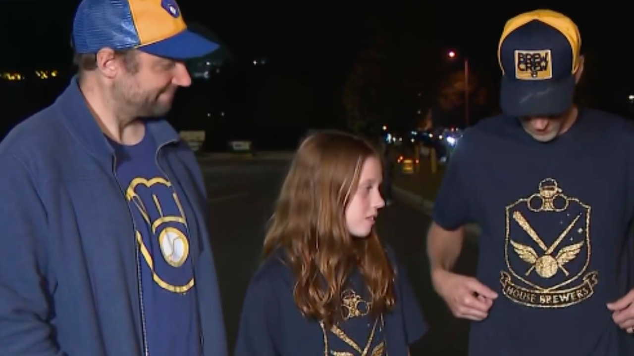 Die-hard Illinois Brewers fans show off custom Brewers T-shirts at ...