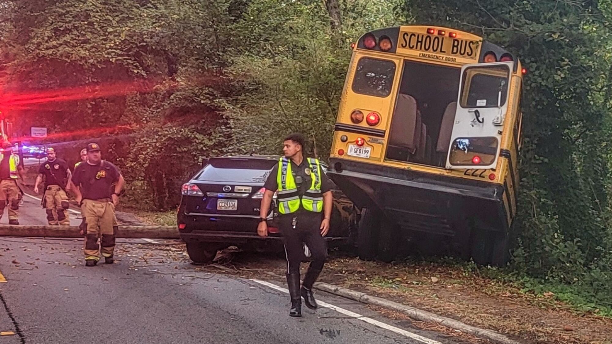 Road reopens after crash between car, bus tears down power poles in Roswell