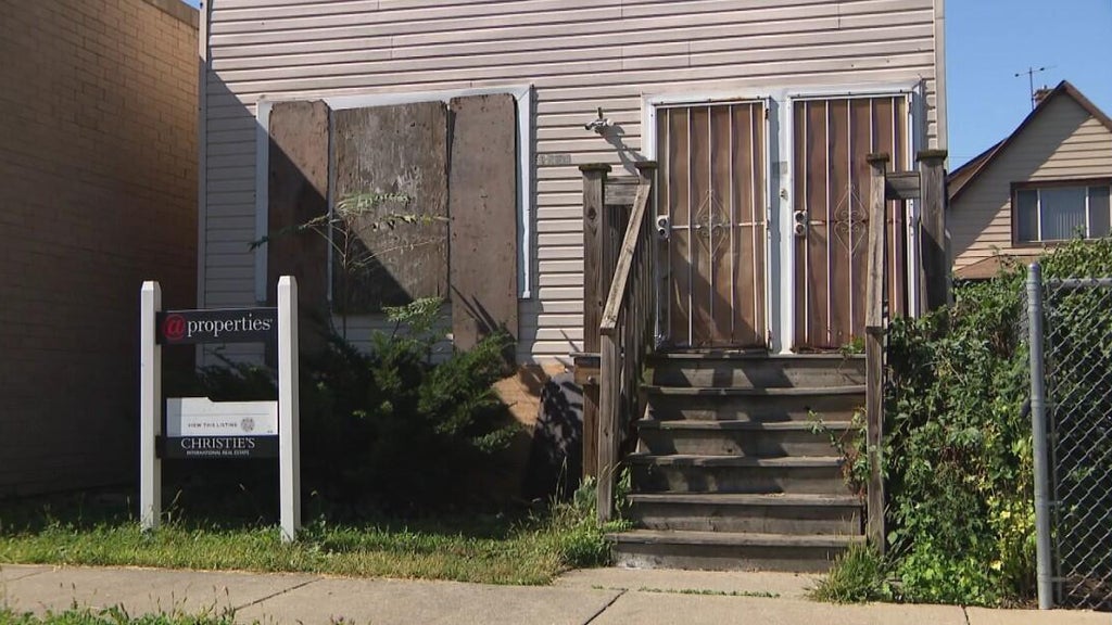 Woman struck by stray bullet through window of Chicago home