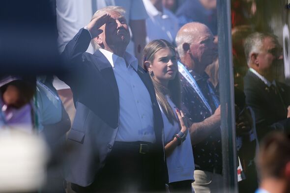 Donald Trump stands behind bulletproof glass at Ryder Cup as everyone ...