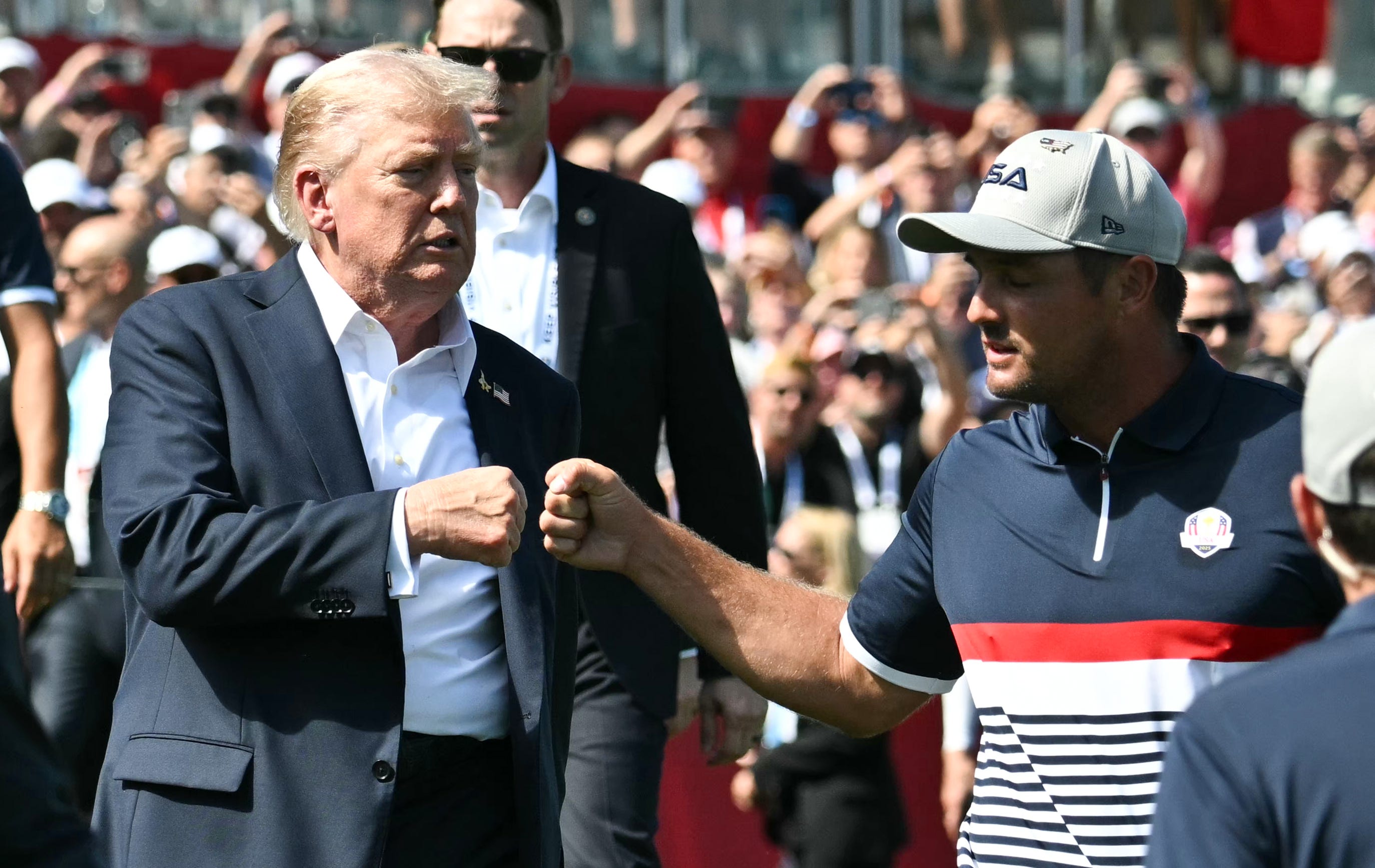 Donald Trump wears golf shoes to Ryder Cup, walks Bryson DeChambeau to ...