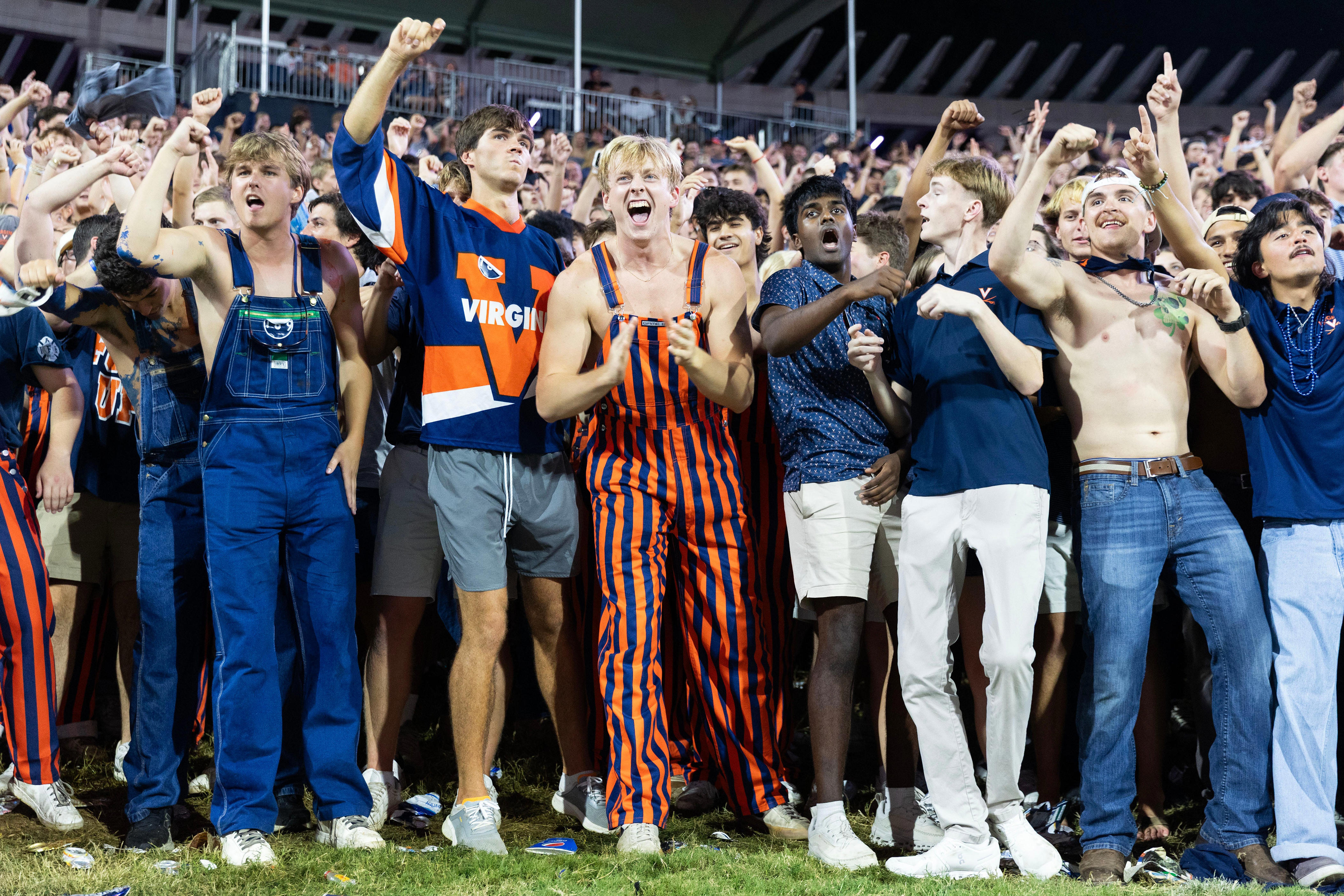 Check out the best photos from Virginia fans storming field after upset ...