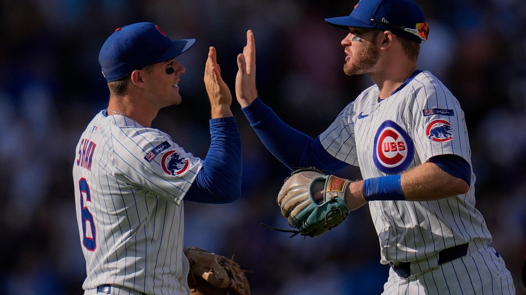 Cubs clinch the top NL wild card after 7-3 win against Cardinals at ...
