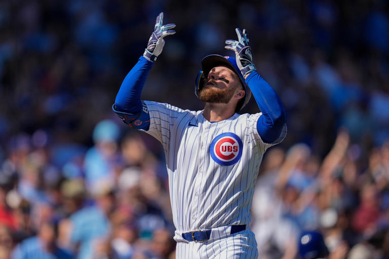 Busch stars as the Cubs beat the Cardinals 7-3 to clinch the top NL wild card