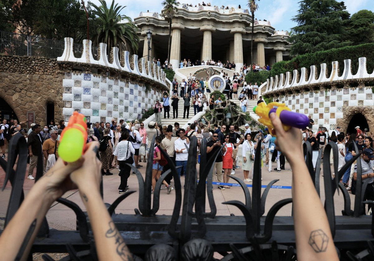 Activists squirt water guns at tourists during anti-tourism protest in ...
