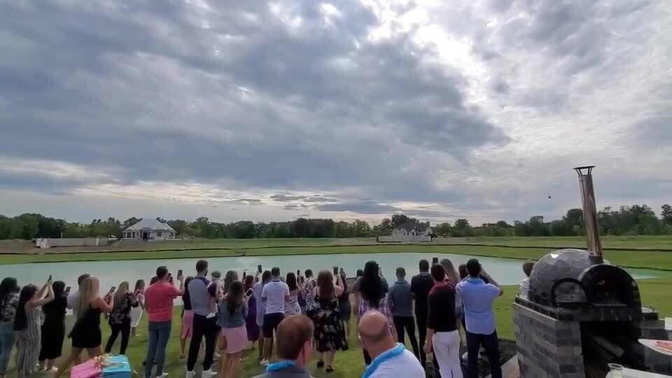 Helicopter Sprays Blue Paint at Gender Reveal Party