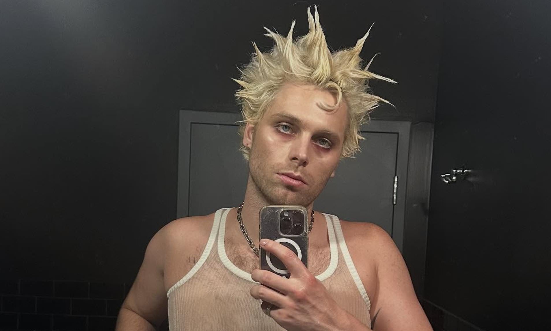 Guess who! Famous Aussie rocks looks unrecognisable as he unveils wild ...