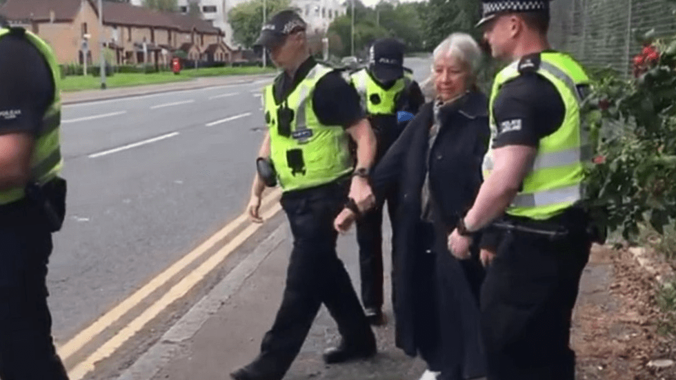 Grandmother, 75, led into police van and arrested after holding 'here ...