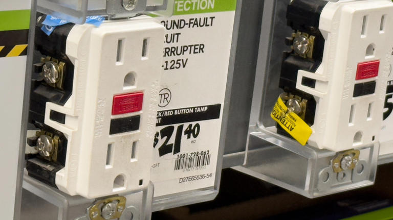 Why Do Some Outlets Have Red And Black Buttons? Here's What They ...