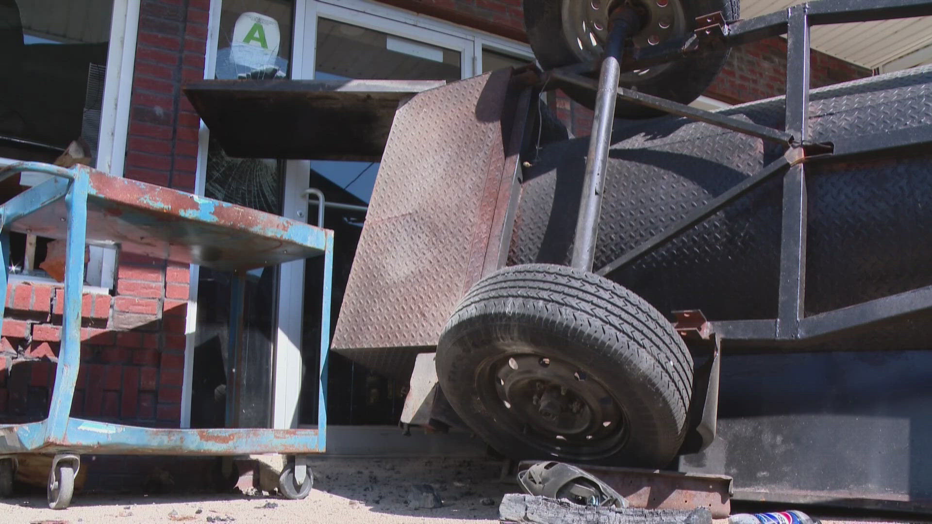 Food Mart missing front window after meat smoker crash