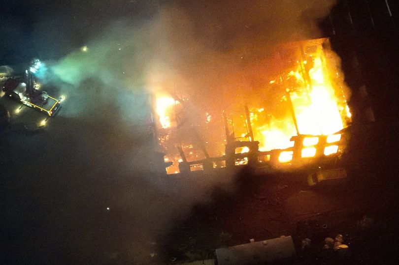 Firefighter seriously hurt tackling huge blaze after building collapses