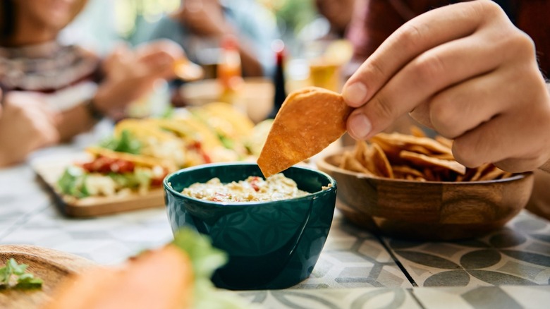 Here's What Science Says About Double-Dipping And Germs