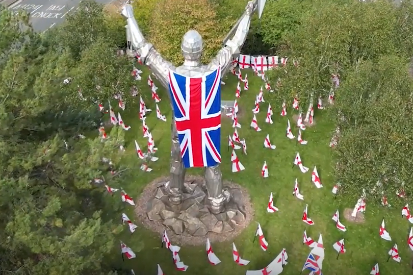 The Midland traffic island crammed with flags including huge one off ...