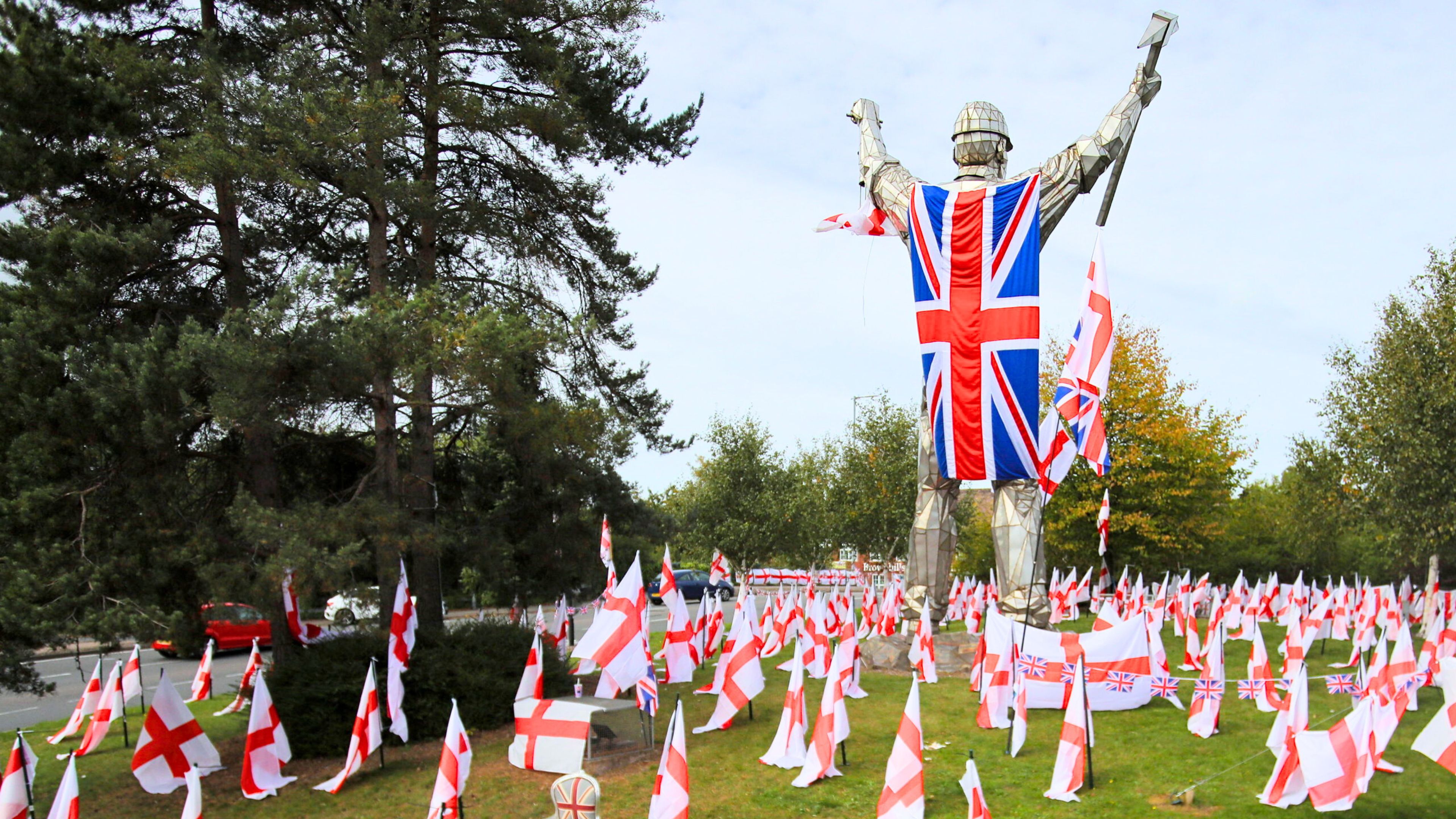 Massive Union Jack draped over roundabout statue as flag wars rage on
