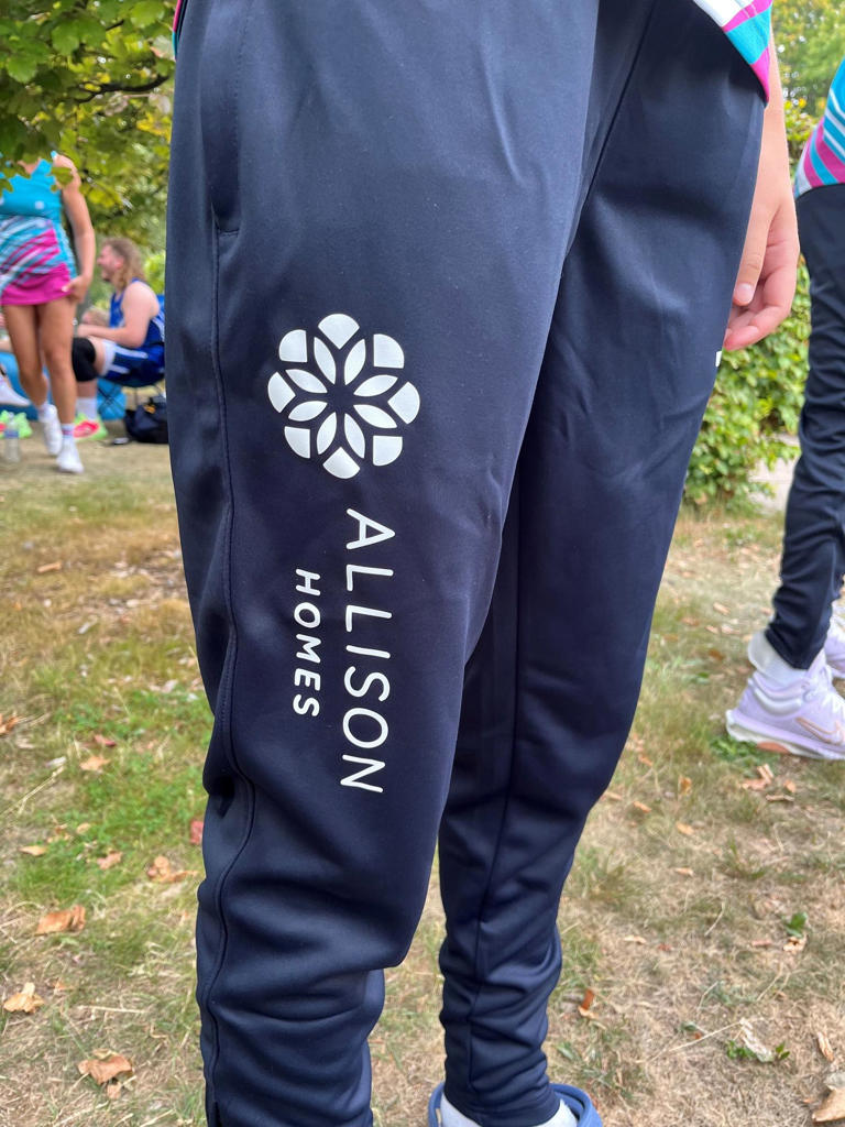 Housebuilder ‘whirls’ to the rescue of rising netball team with kit ...
