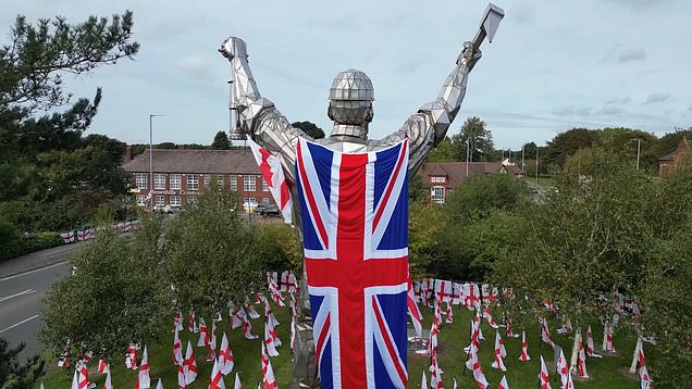 Massive Union Jack draped over 40-foot roundabout statue as flag wars ...