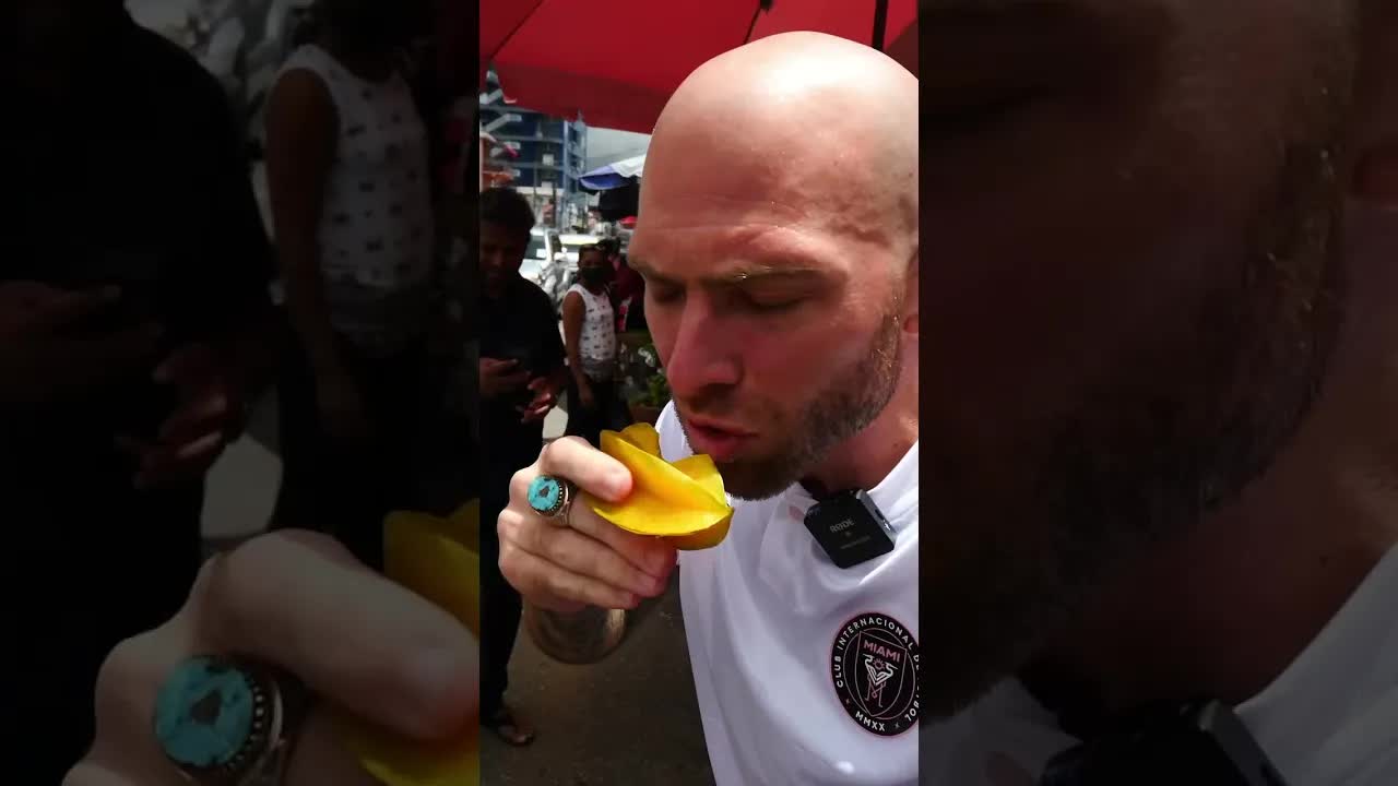 trying guyanese exotic fruits at a guyana street food market