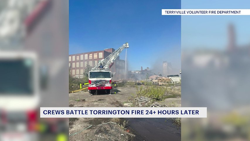 Crews battle hot spots as Torrington fire burns into second day
