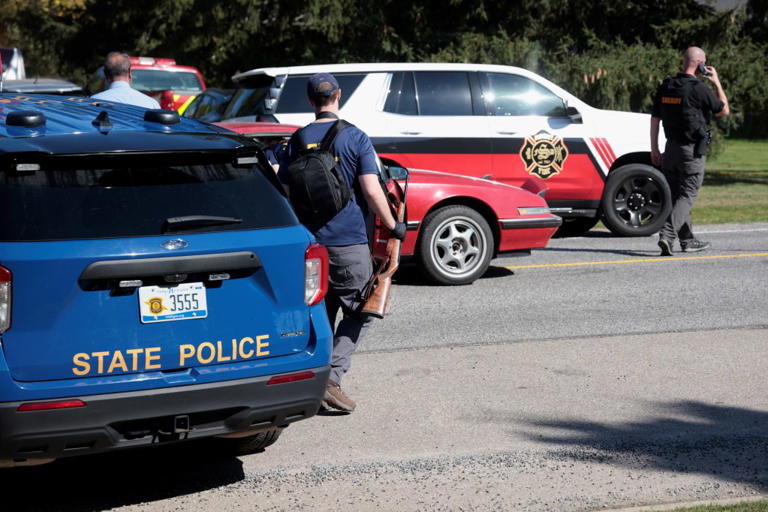Armed man busted after plowing car through police barricade outside ...