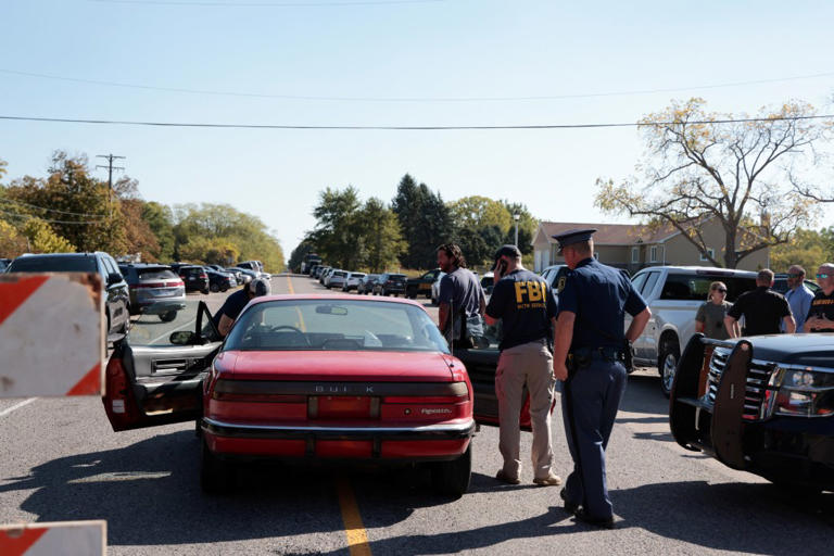 Armed man busted after plowing car through police barricade outside ...
