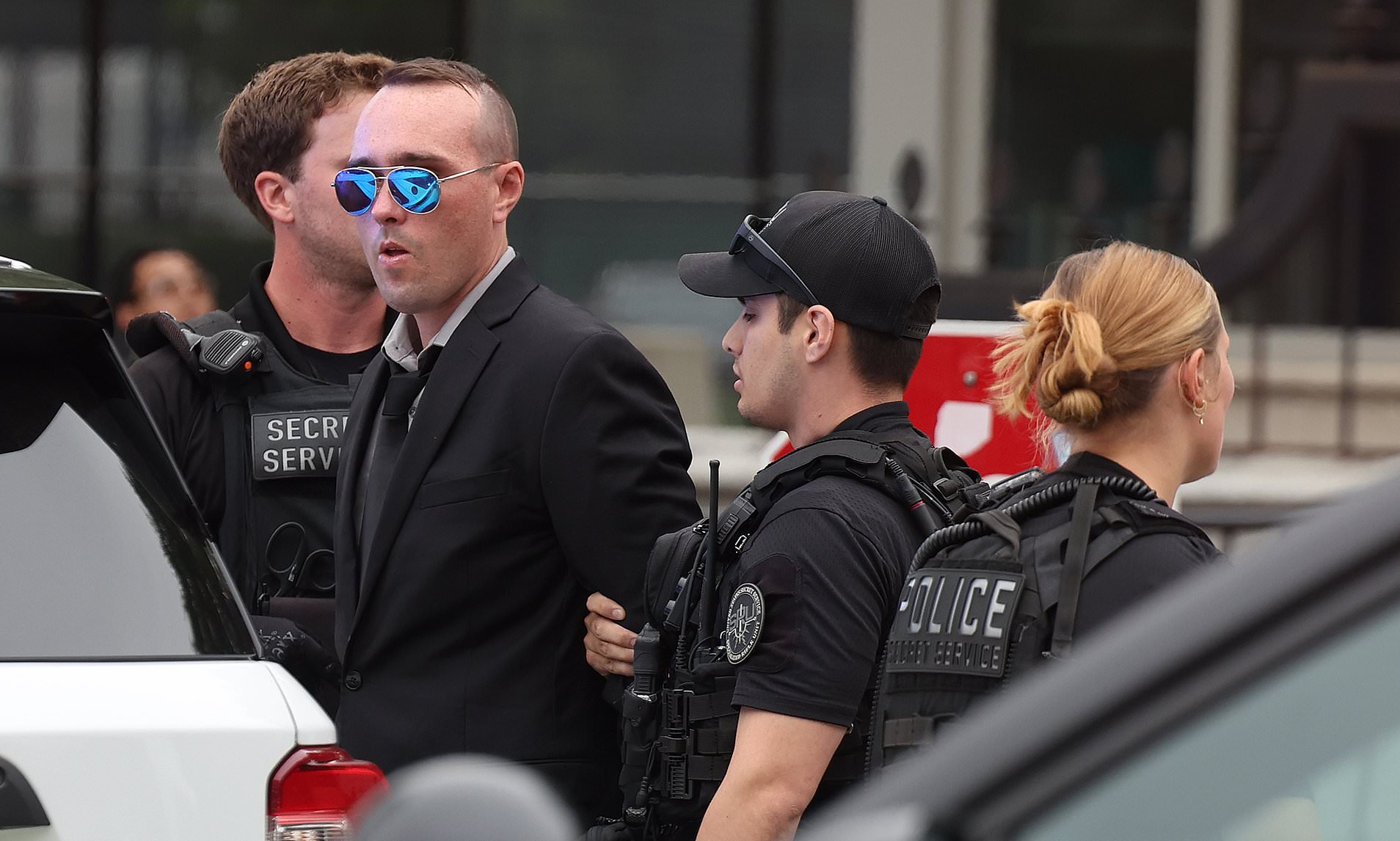 Suited aviators-wearing man arrested by Secret Service after ...