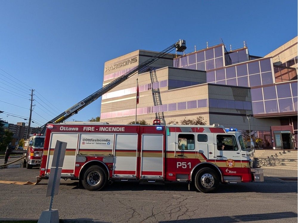 Ottawa firefighters deal with flames on roof of commercial highrise