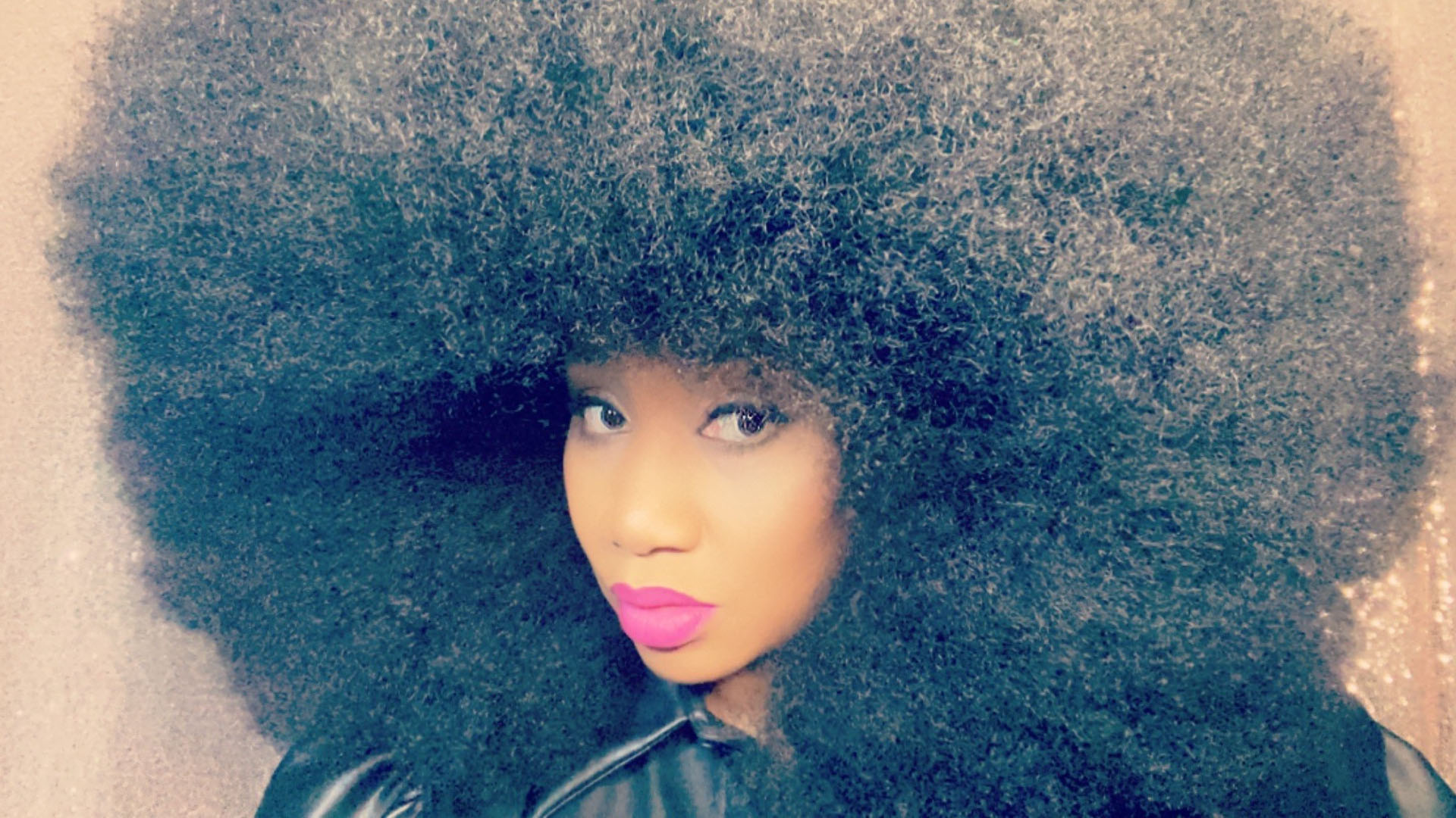 Aevin Dugas celebrates world record for largest afro and becomes GWR ICON