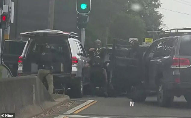 Heavily armed tactical police stop traffic and open fire on black Mercedes