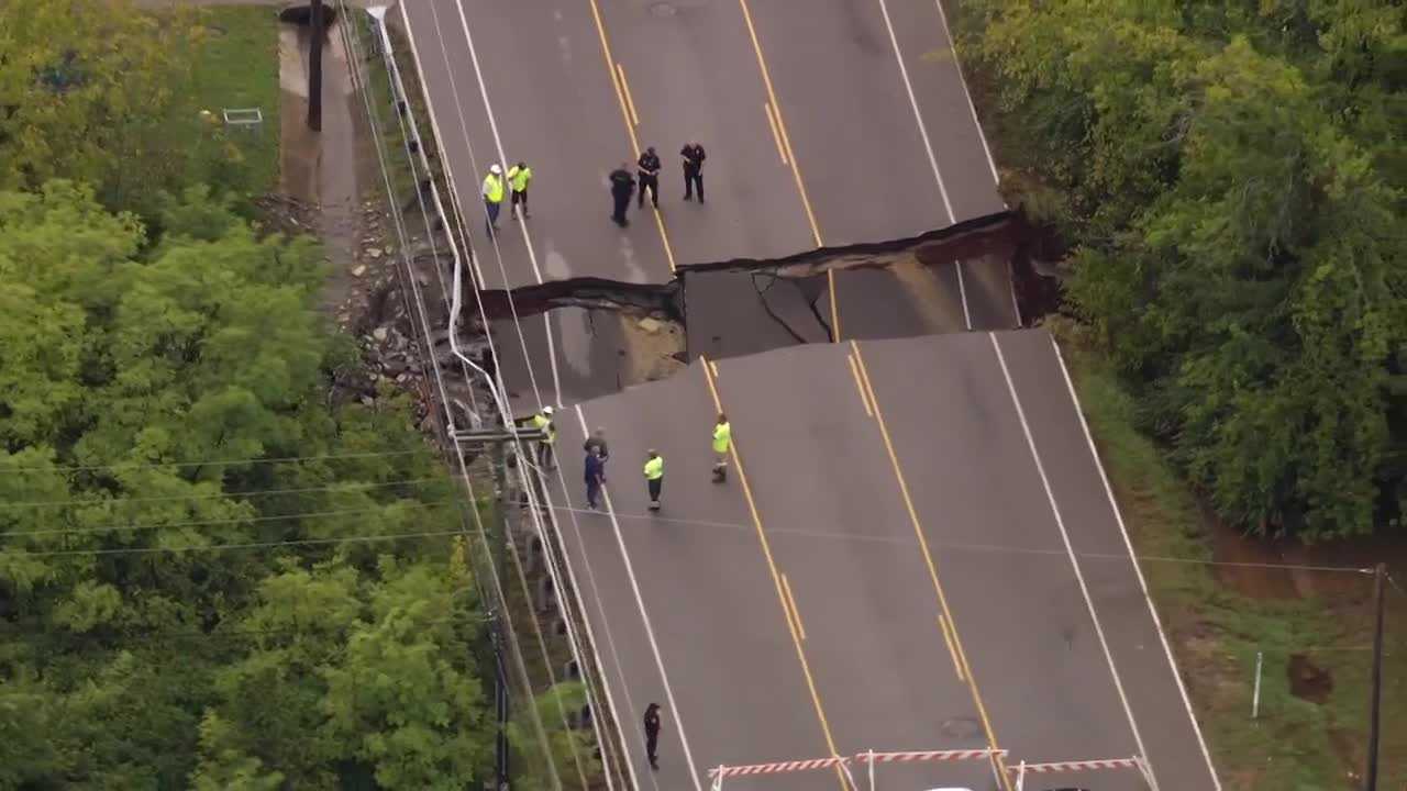 Massive sinkhole opens up across entire road in Kentucky
