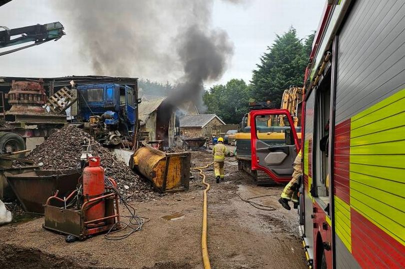 Huge fire breaks out involving outbuilding and diesel tanks as six fire ...