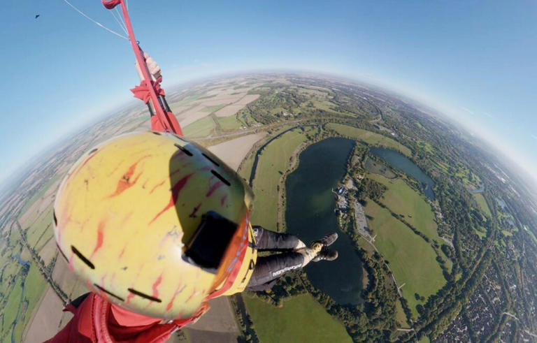 Group of 17 skydivers perform rare ‘water drop’ plunge into lake at 100mph