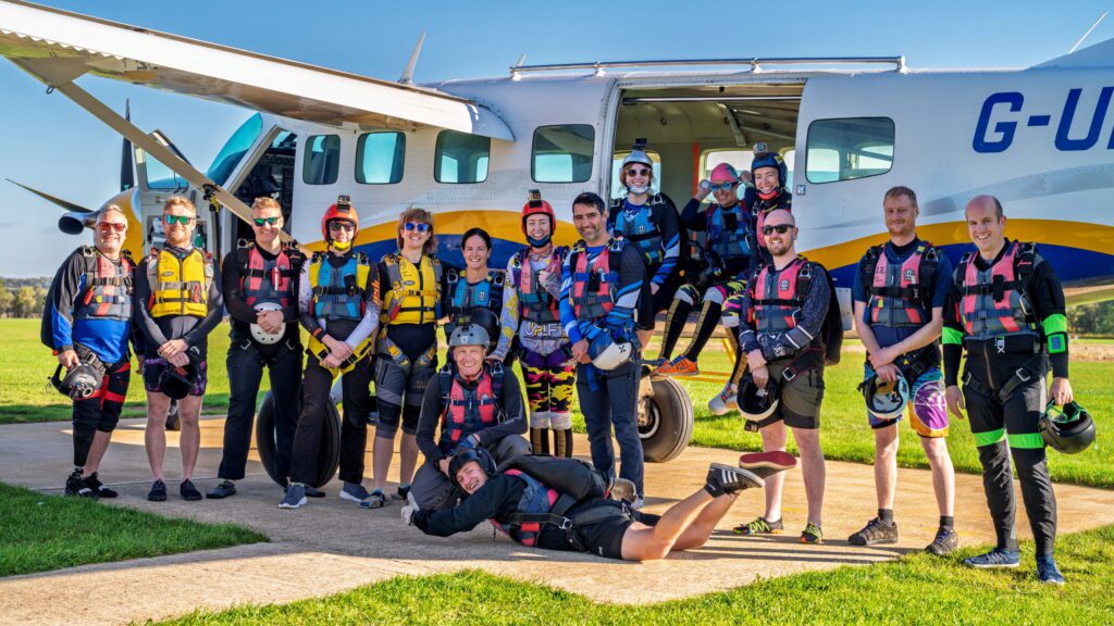 Group of 17 skydivers perform rare ‘water drop’ plunge into lake at 100mph