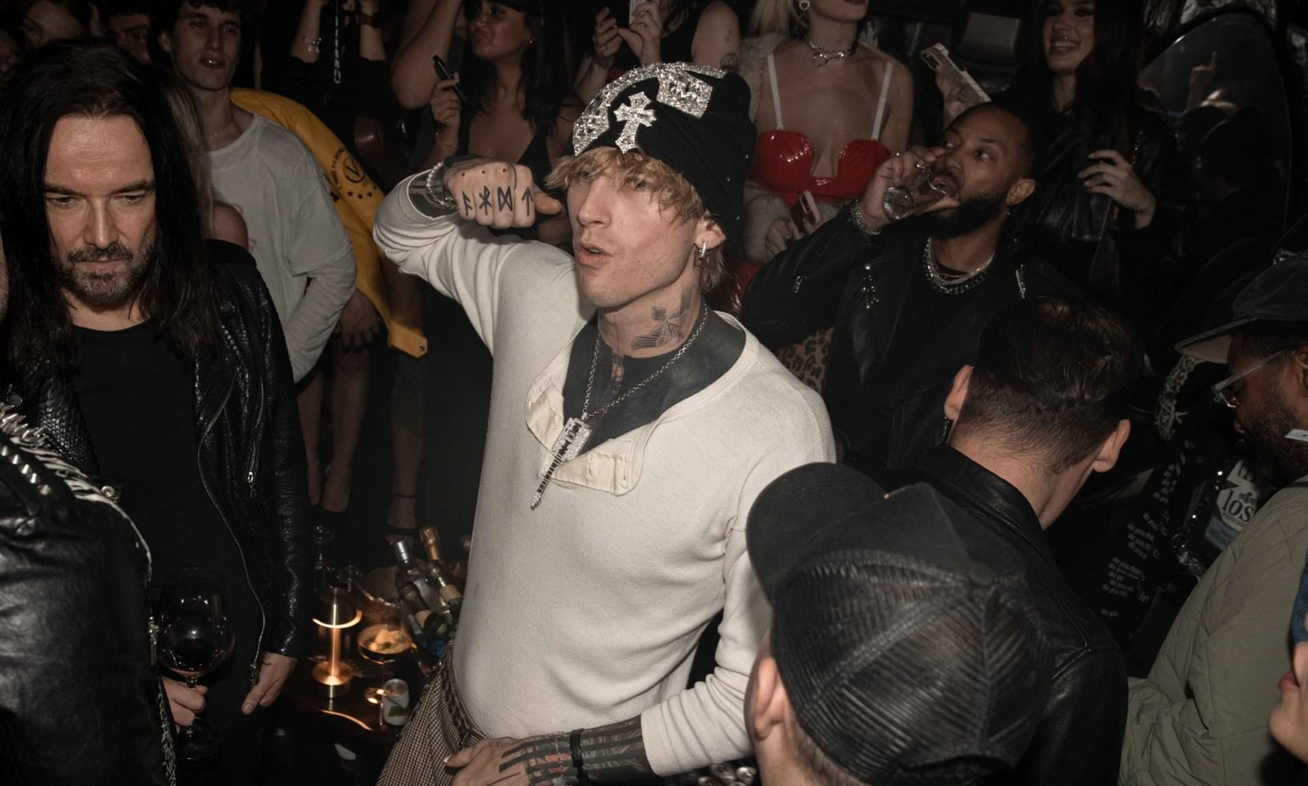 Machine Gun Kelly looks in high spirits as he parties up a storm at ...