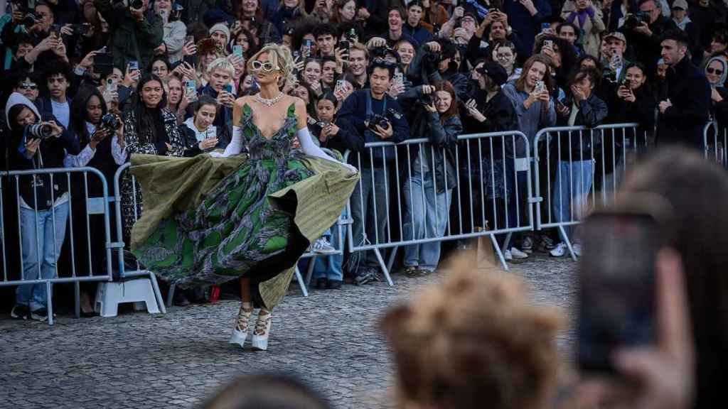 Paris Hilton Spreads ‘Pure Magic in Paris' in Photos Wearing Feathered Gown