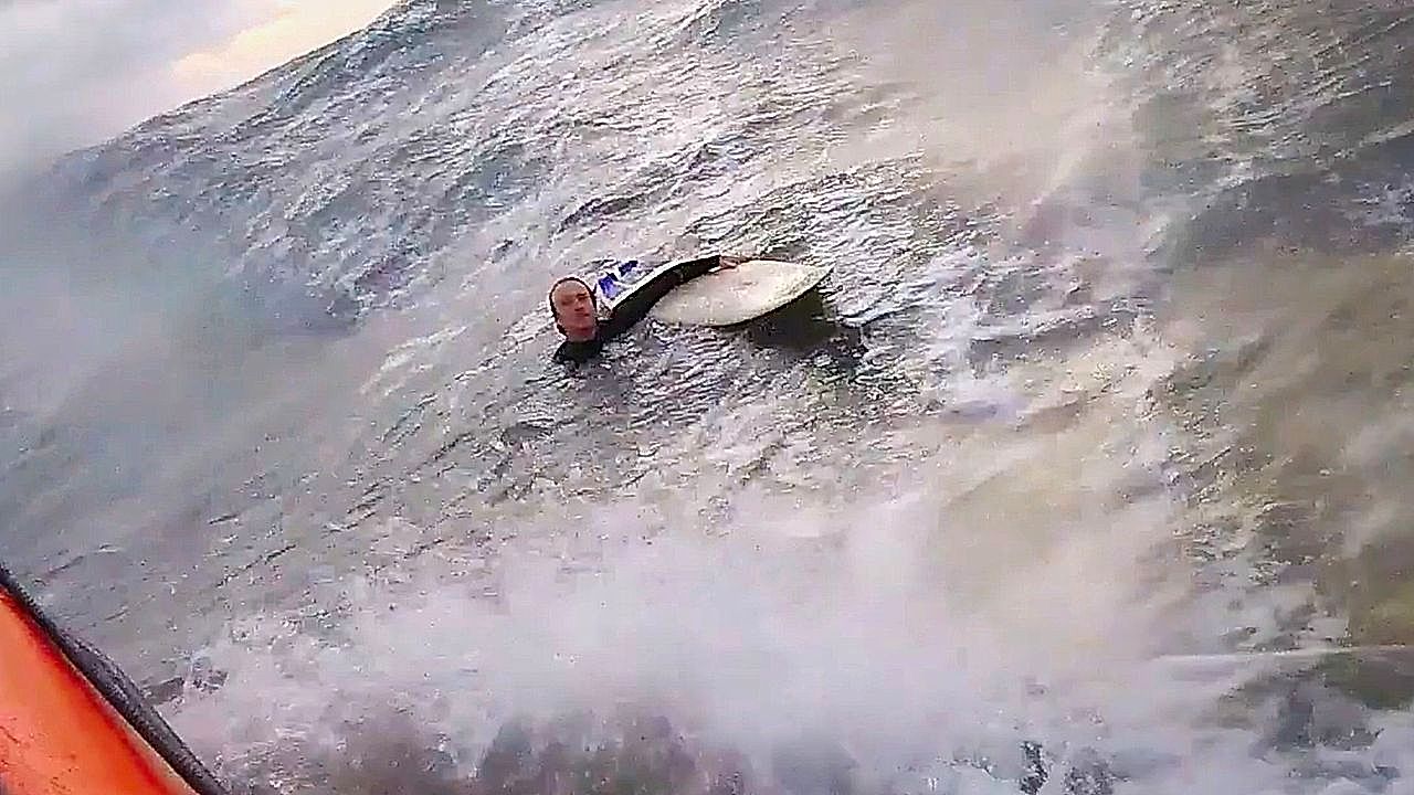 Stranded surfer rescued after been swept out to open sea