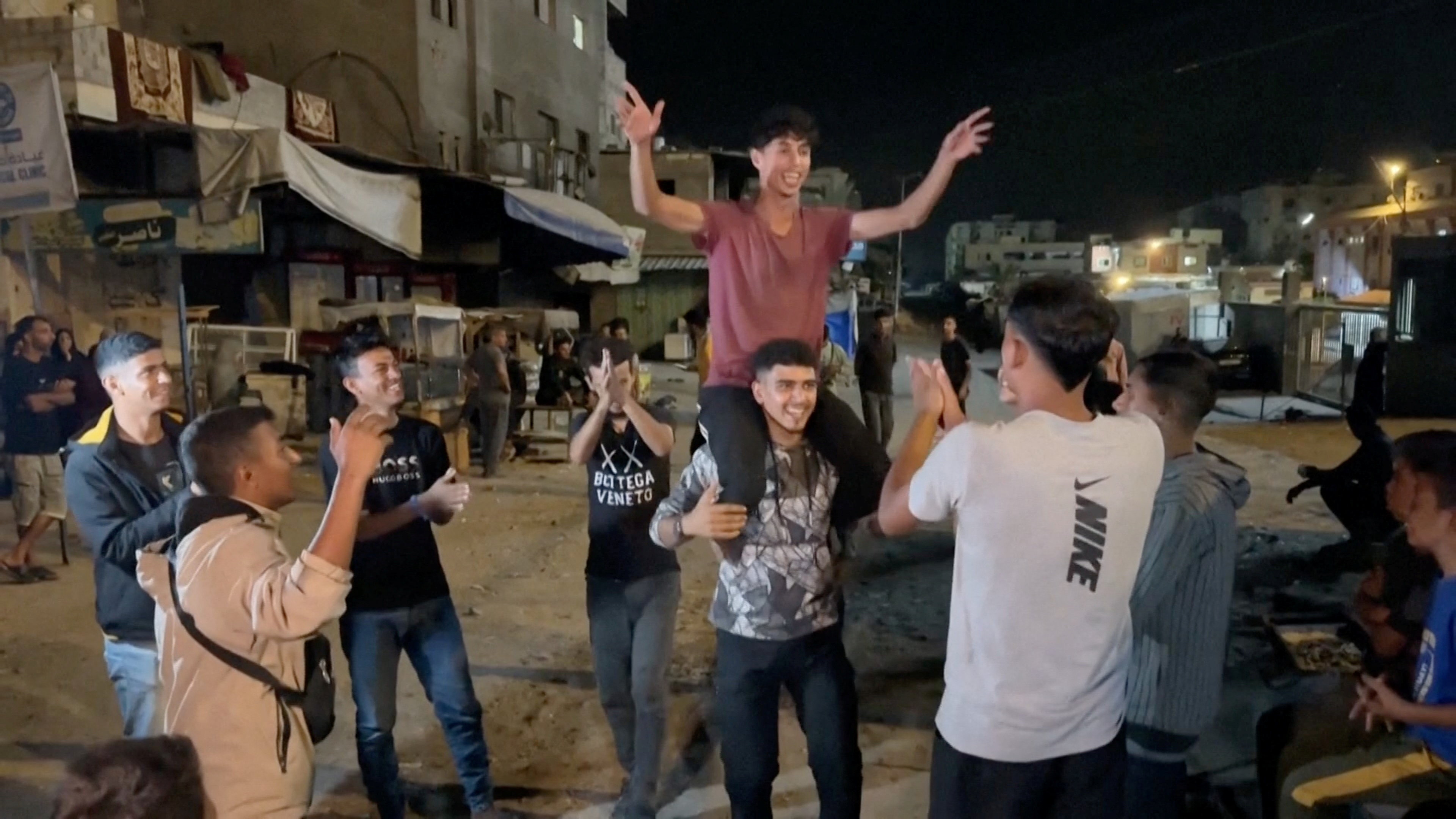 Palestinians in war-ravaged Gaza celebrate ceasefire news, joy in Tel Aviv