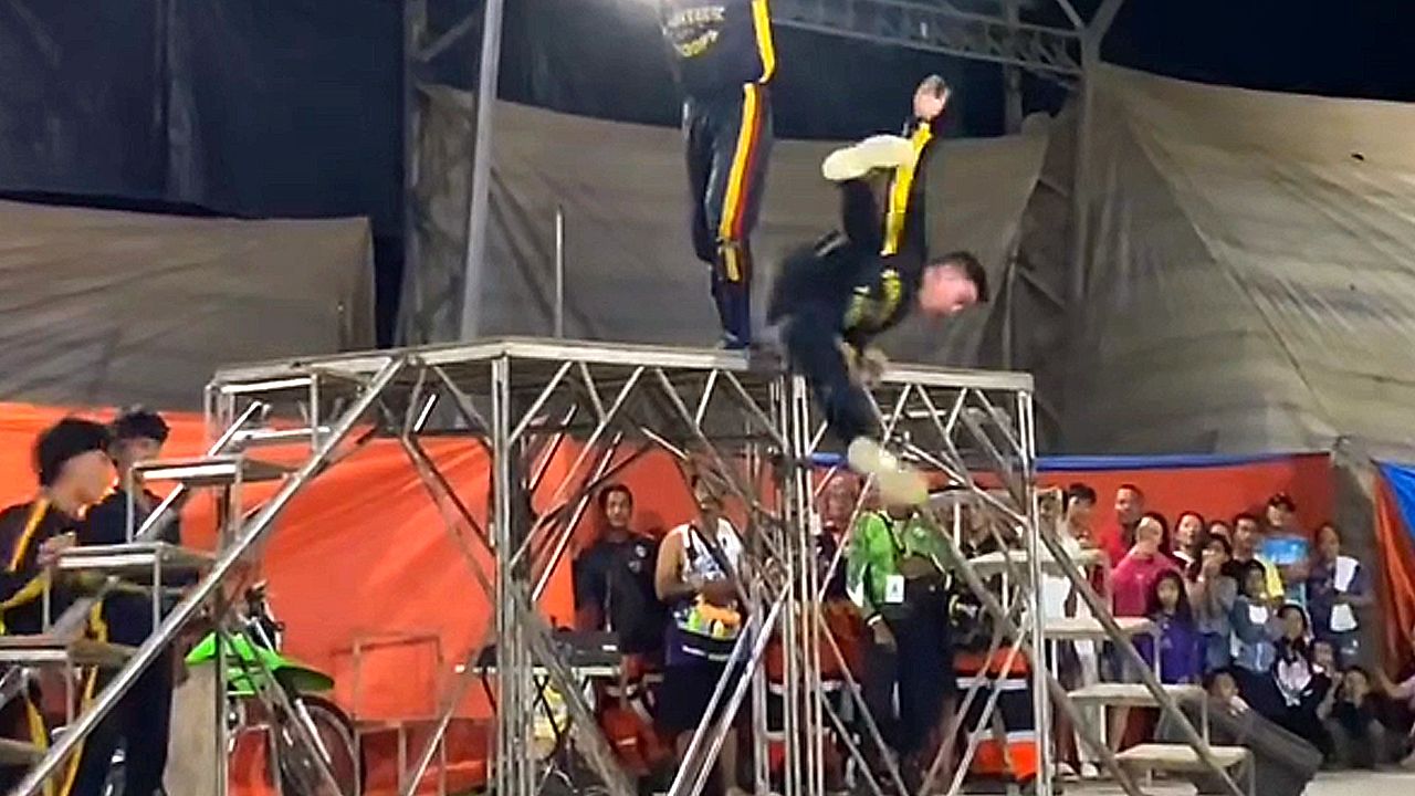 Falling acrobat tries to recover from foul-up only to fail again