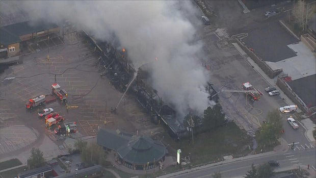 Fire destroys shopping center in Nederland, investigation set to begin ...