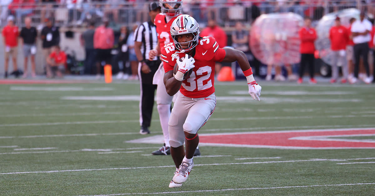 Ohio State tailback Isaiah West sheds black stripe