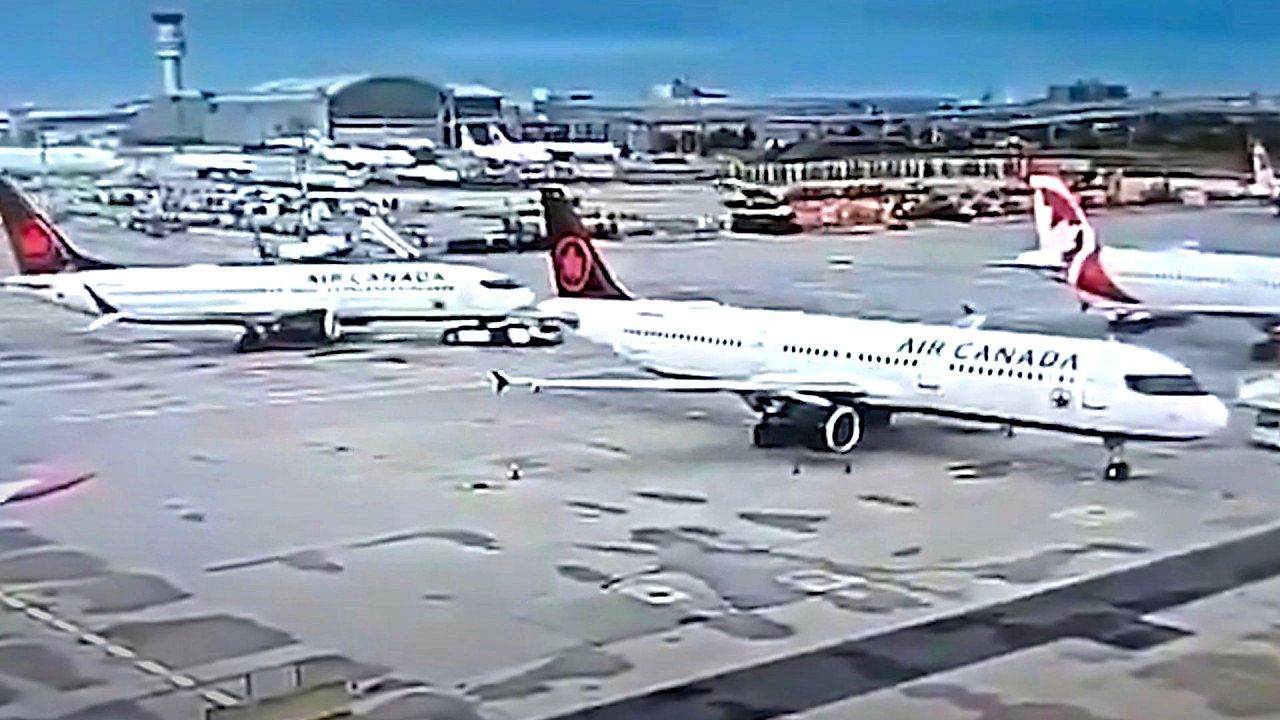 Can't park there! Boeing 737 crashes into two parked jets at Toronto ...
