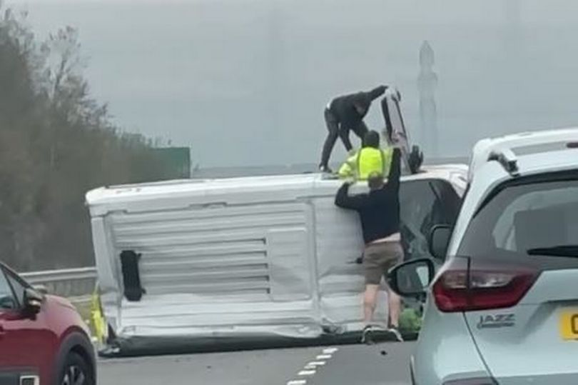 People seen pulling driver from overturned van after horror crash