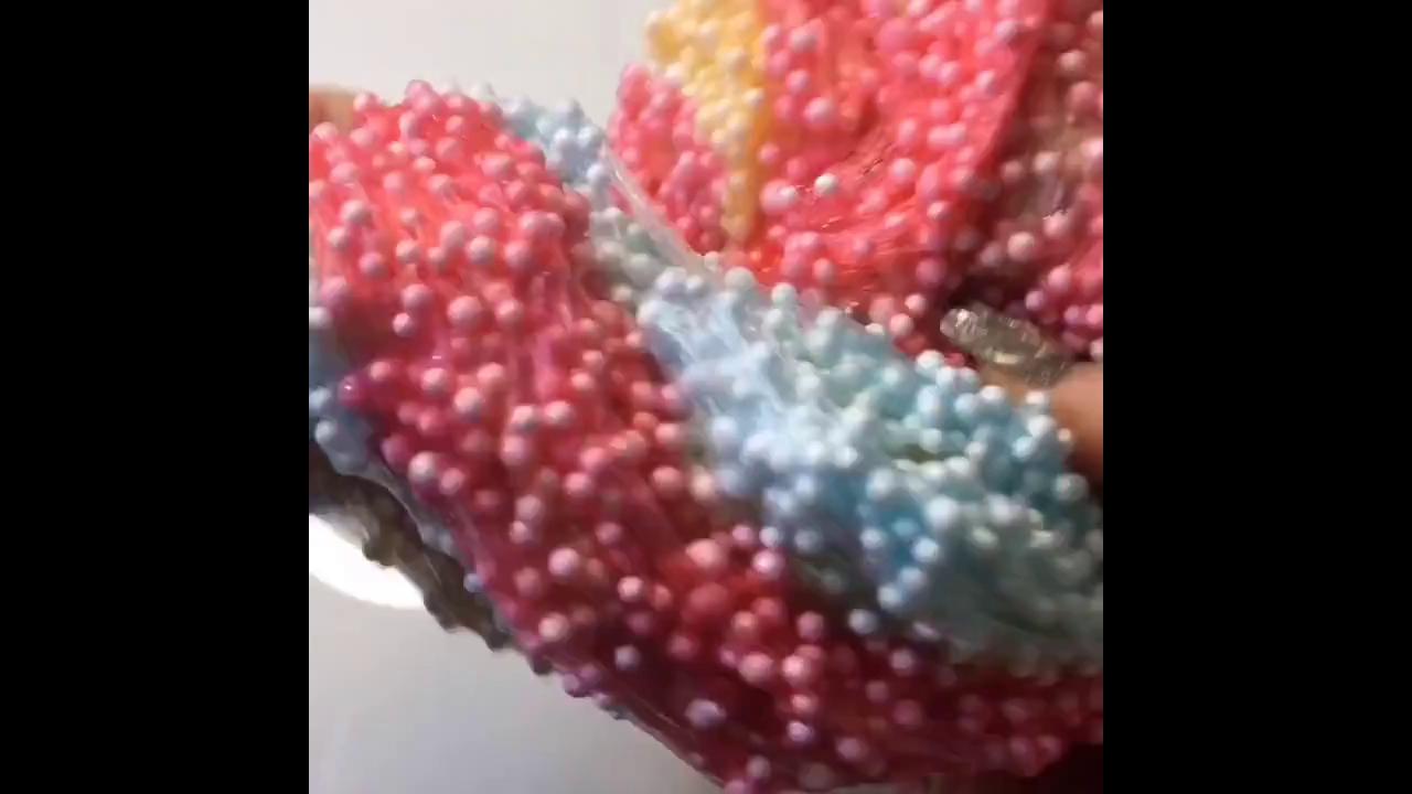 Squeezing Colorful Beads On A Soft Slime