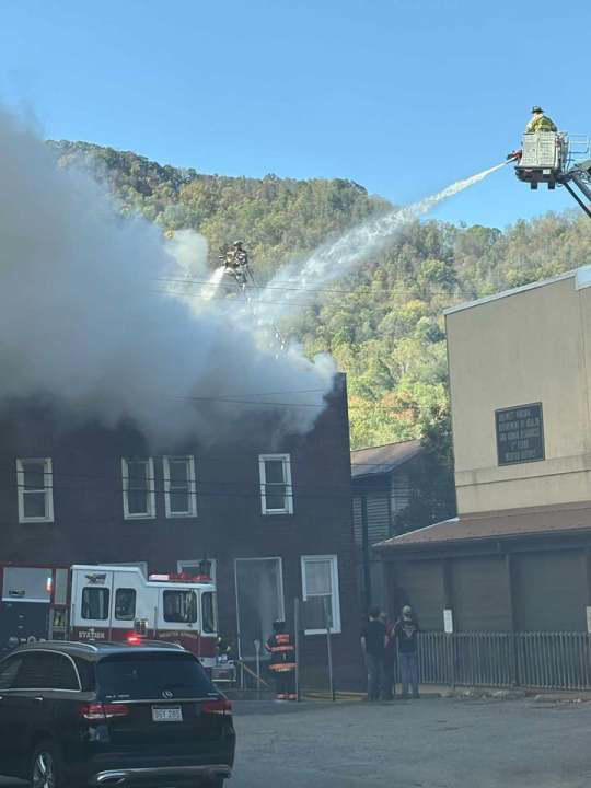 Excavators called to assist with fire at old Webster Hotel