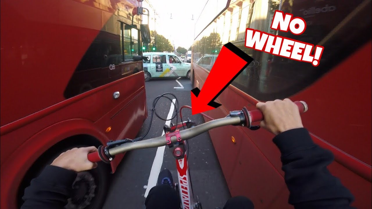 Little Harry attempts a no front wheel race through London