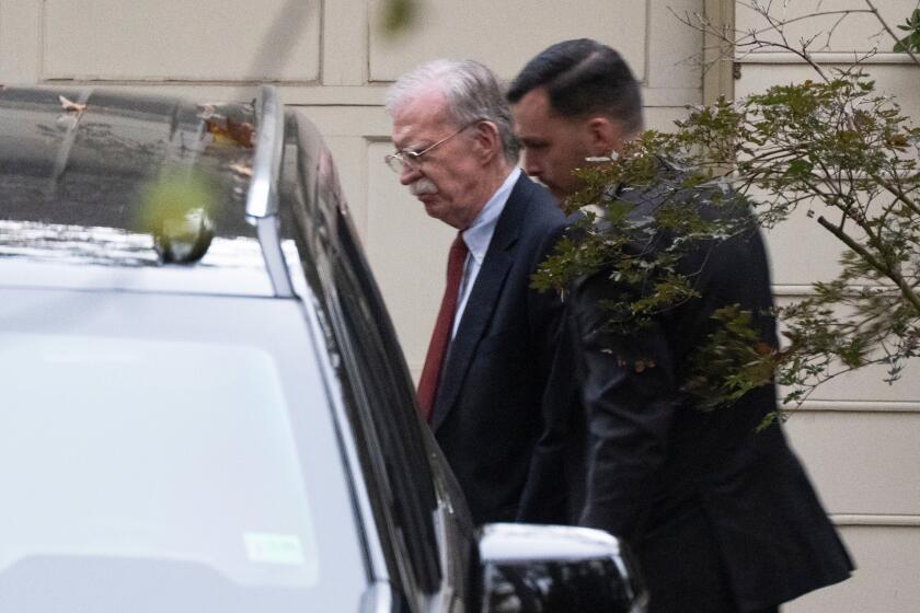Bolton arrives at court to surrender to authorities on charges in ...