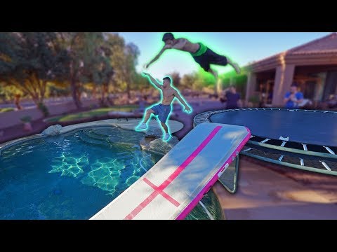 Friends jump from trampoline and airtrack into backyard pool