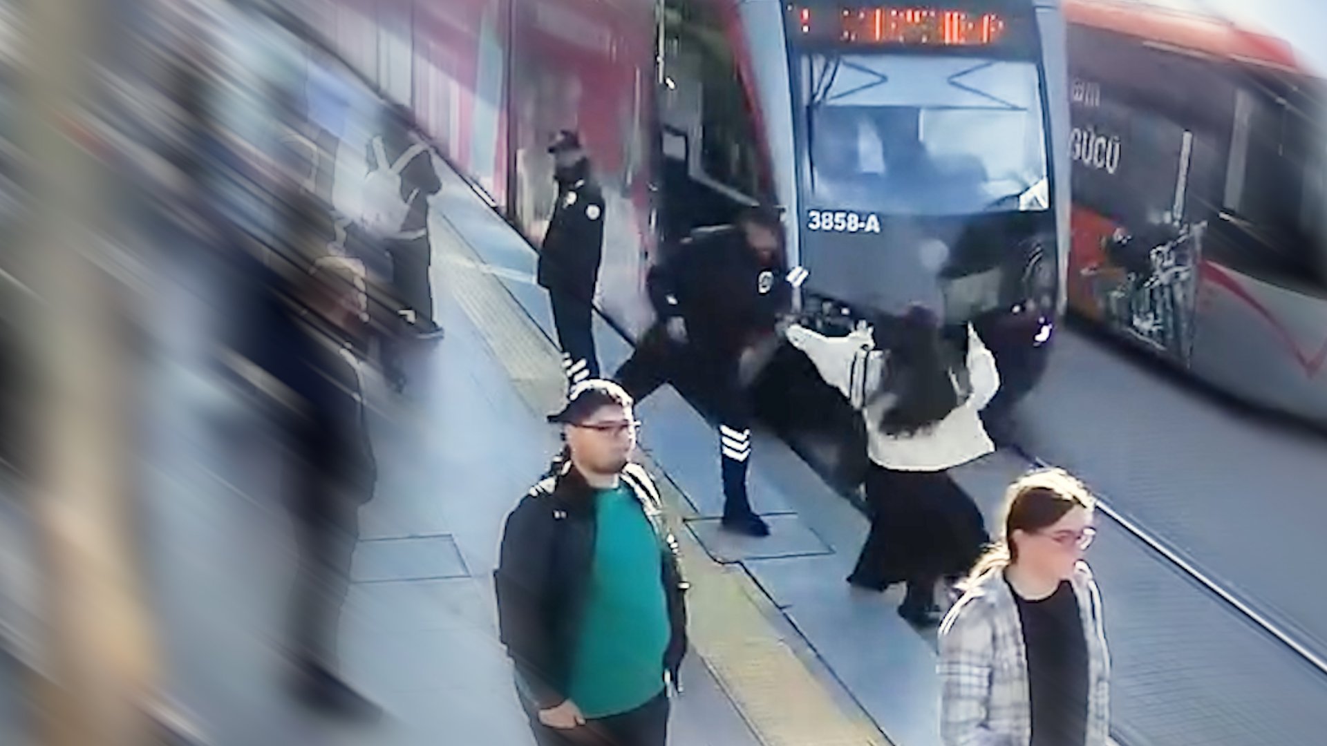 Hero security guard saves woman from oncoming tram