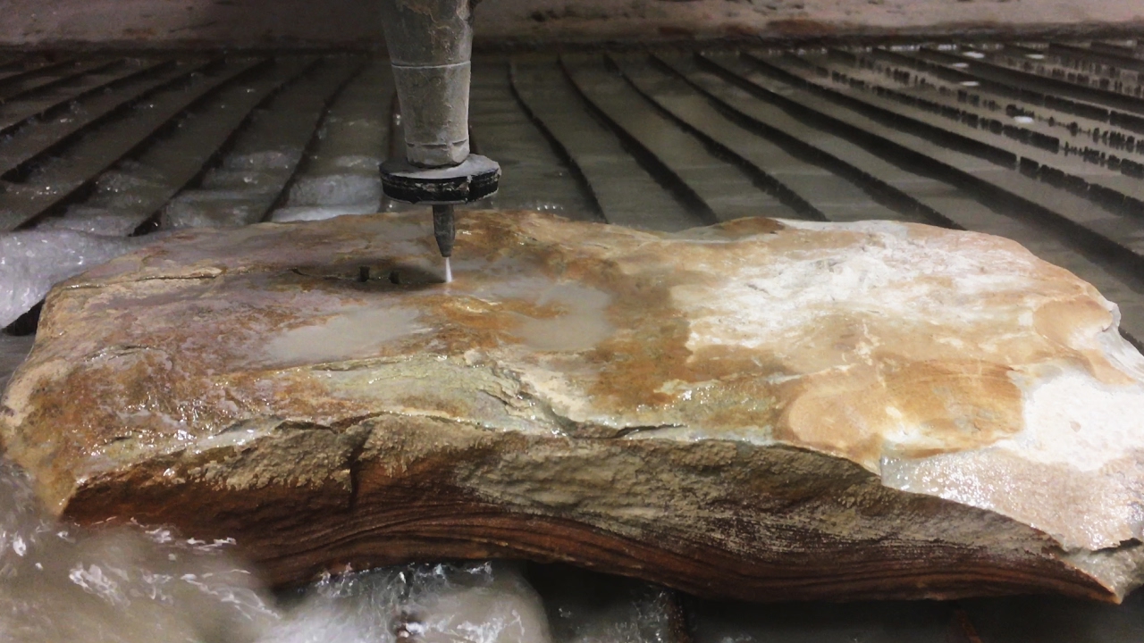 Cutting rock with a 60,000 PSI waterjet